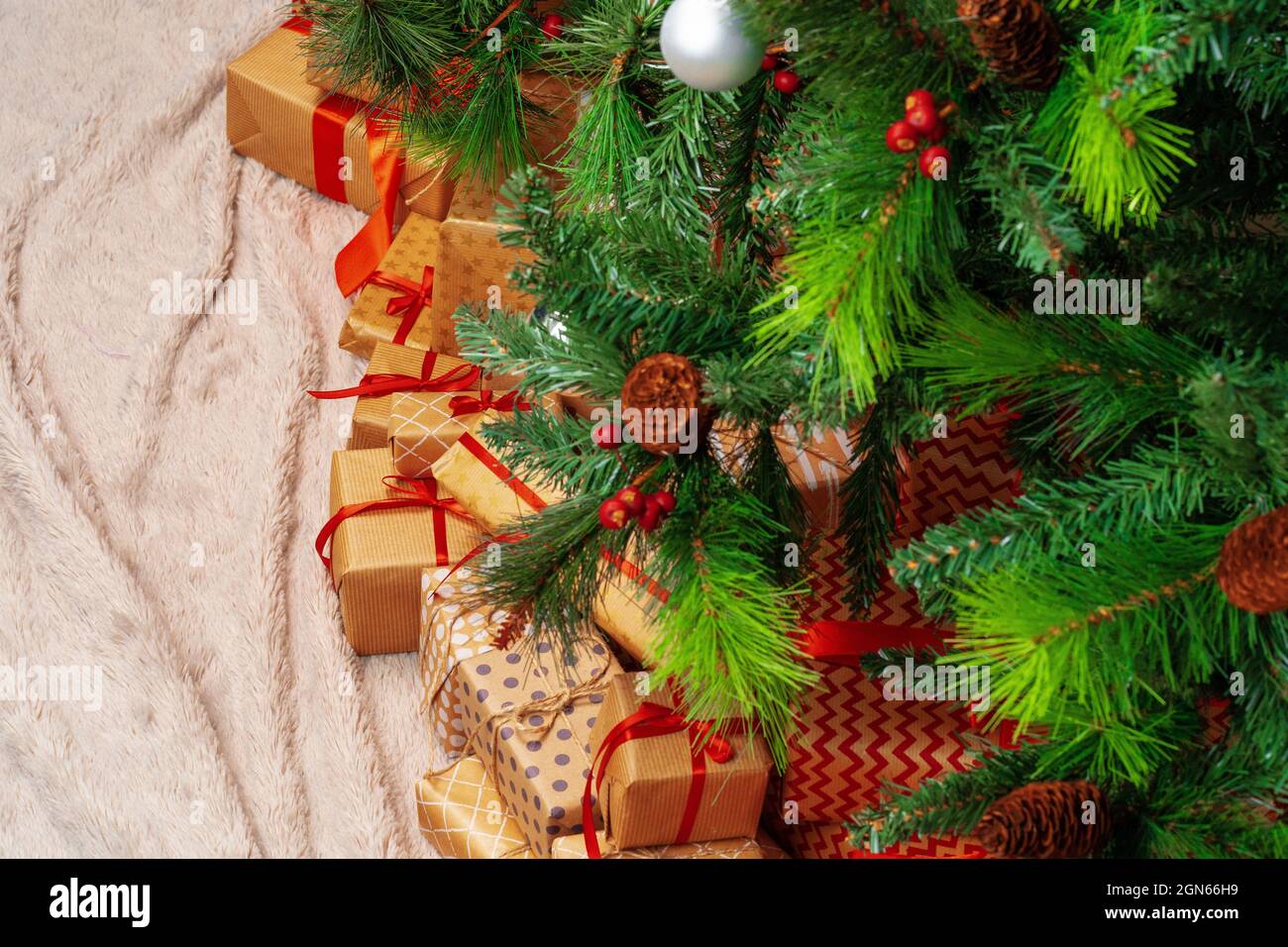 Stack of wrapped presents under Christmas tree Stock Photo - Alamy