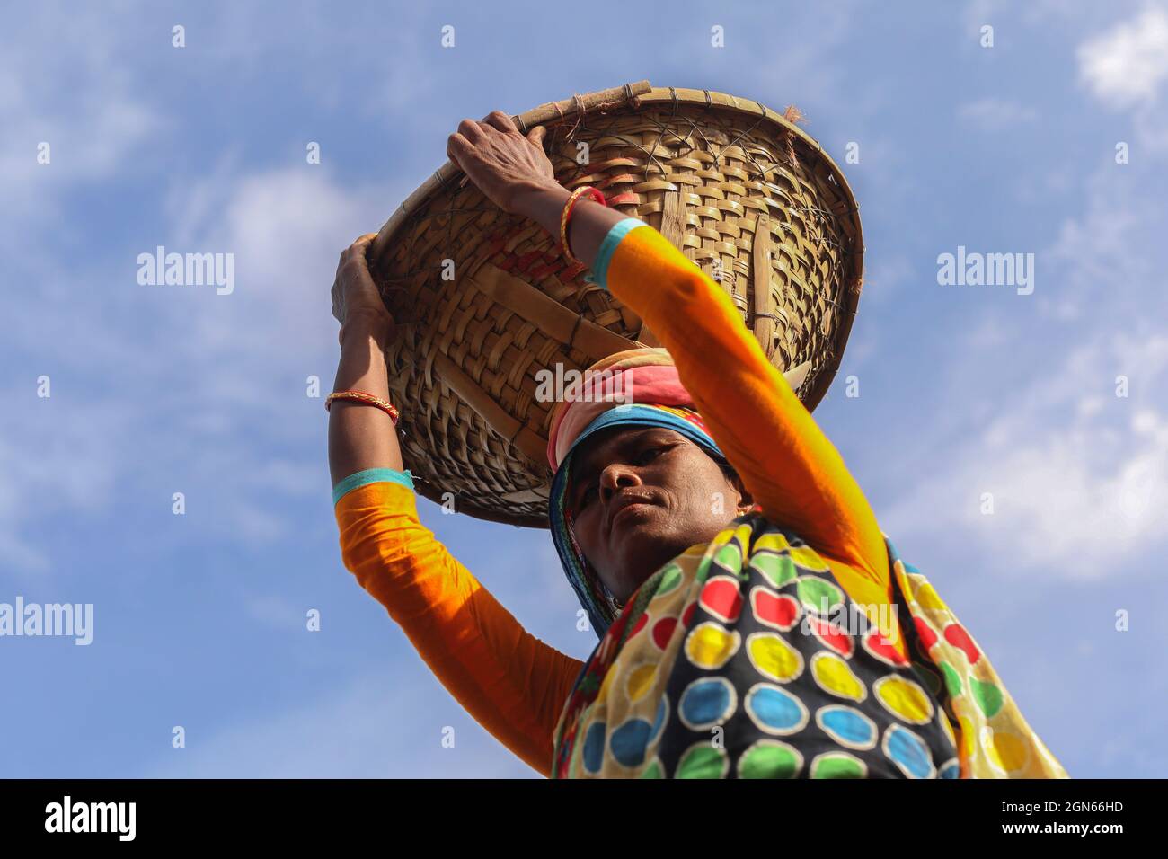 Bangladeshi woman labour carries heavy loads of sand balanced on her ...
