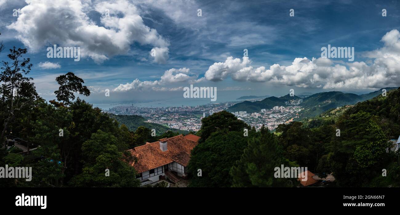 Aerial shot of a house on the mountain overlooking the city Stock Photo ...