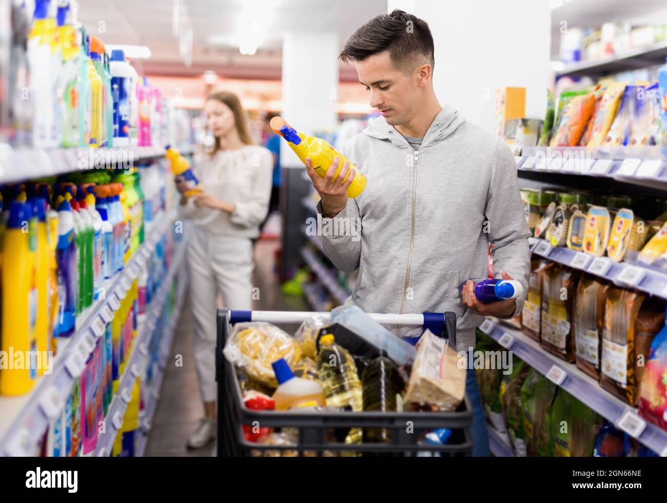 Serious young customer choosing goods hi-res stock photography and ...