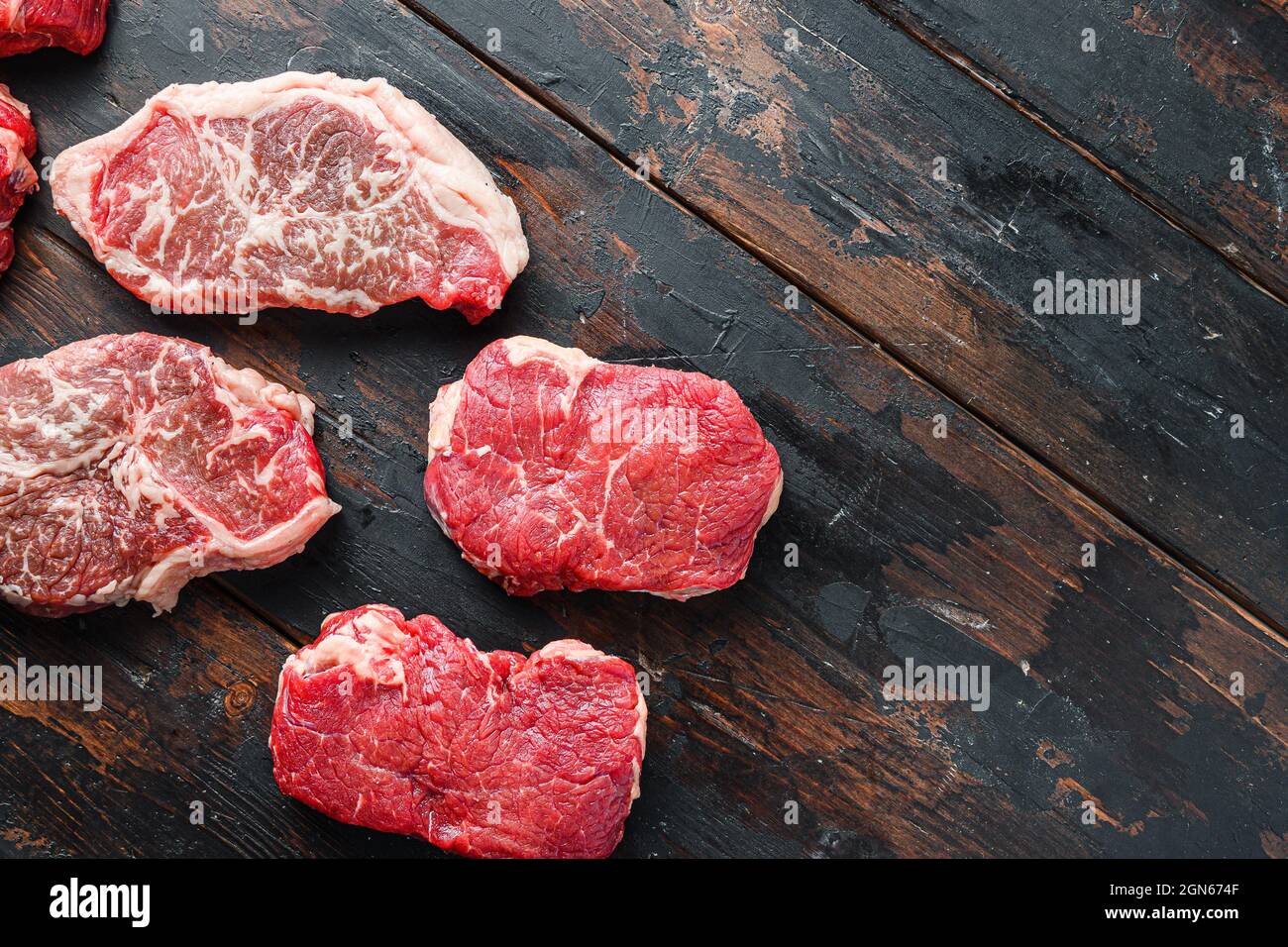 Set of organic raw beef steakes rump, chuck roll and top blade cut on ...