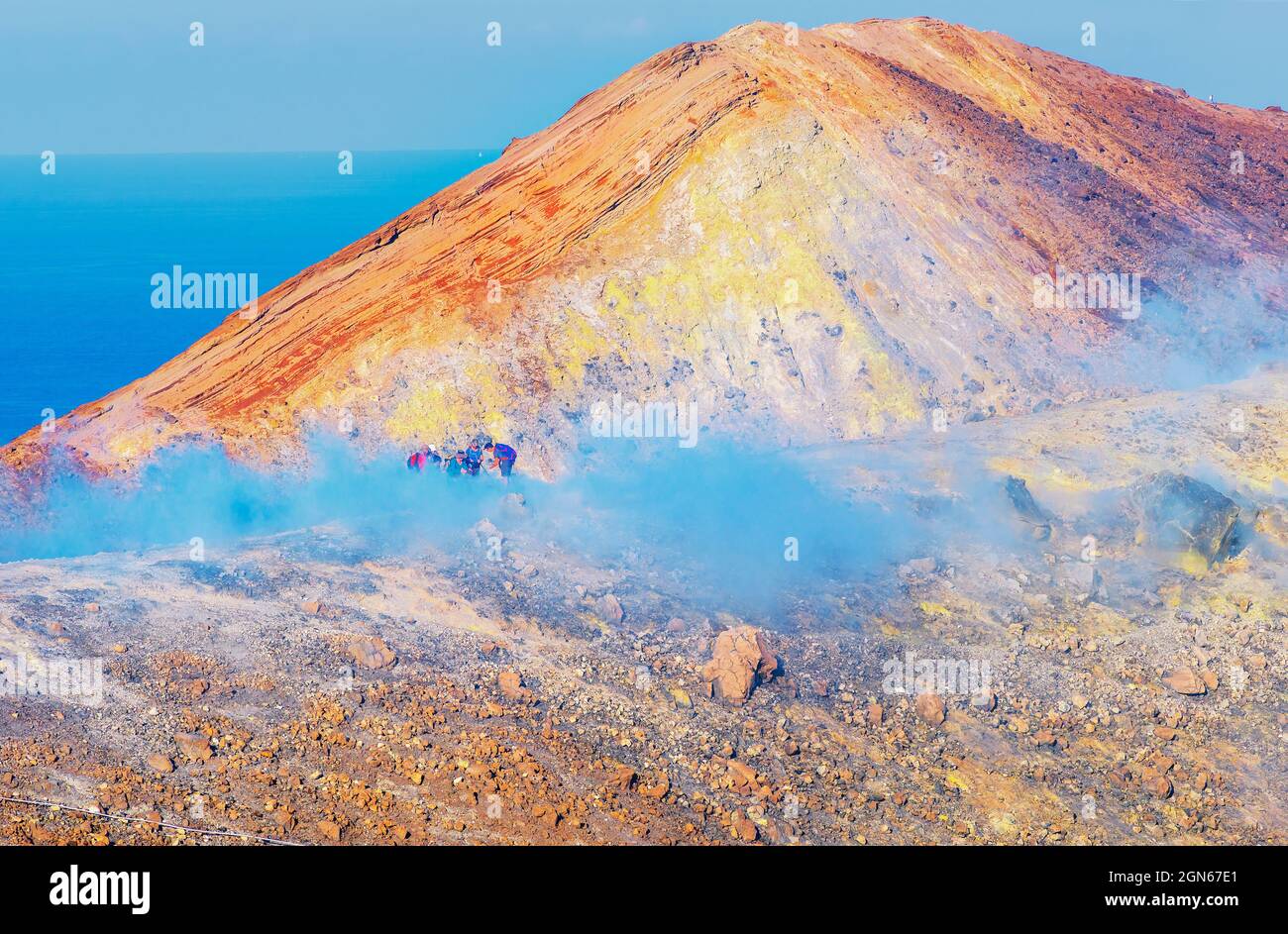 People walking through fumaroles on Volcano Gran crater rim, Vulcano ...
