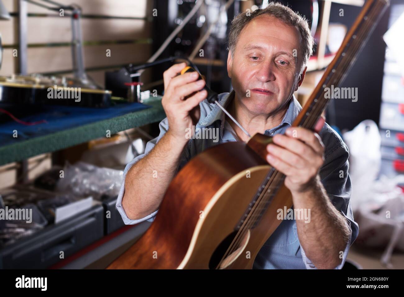 Guitar repairing hi-res stock photography and images - Alamy