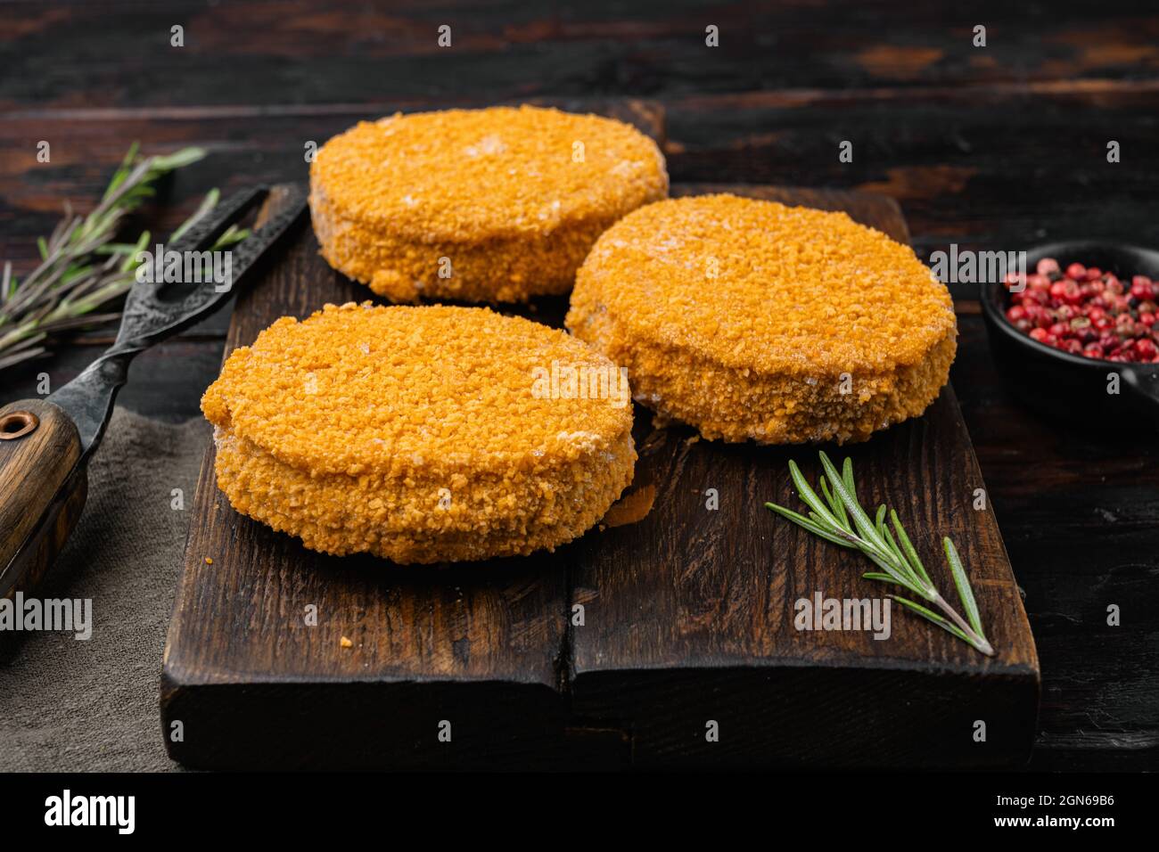Breaded fish patties set, on old dark wooden table background Stock ...