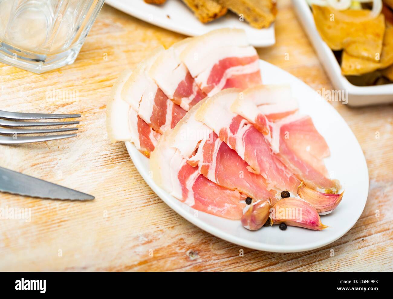 Salted pork belly bacon slices with garlic Stock Photo - Alamy