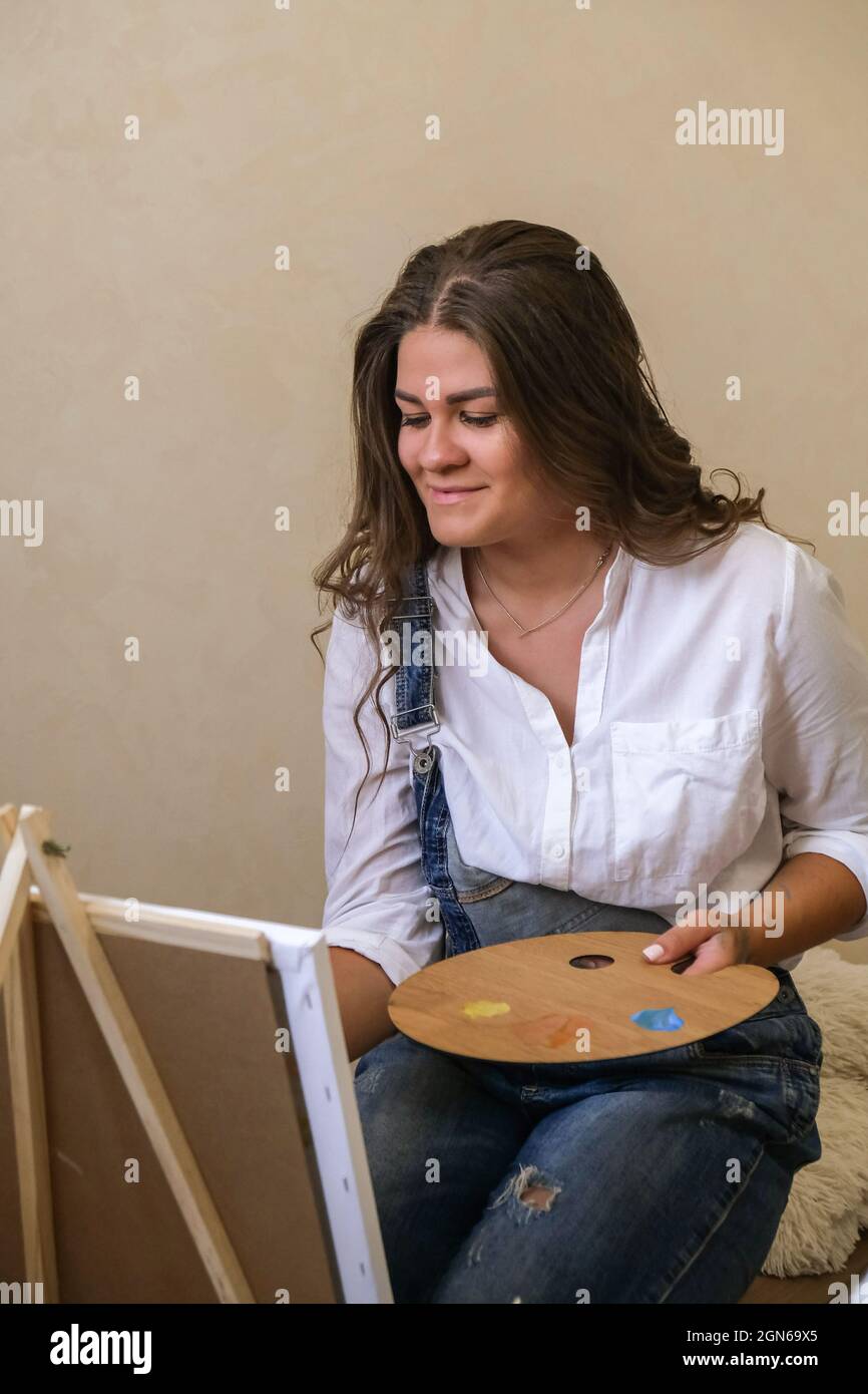 Creative painter in working process. Artist workplace, hobby, craft ...