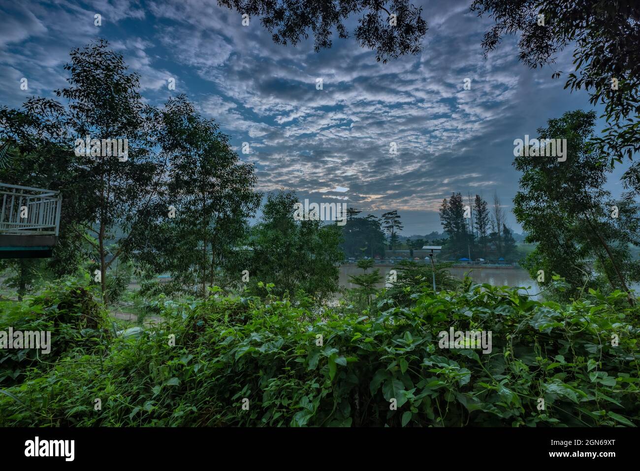 the view in the morning on a lake with a beautiful sunrise Stock Photo ...