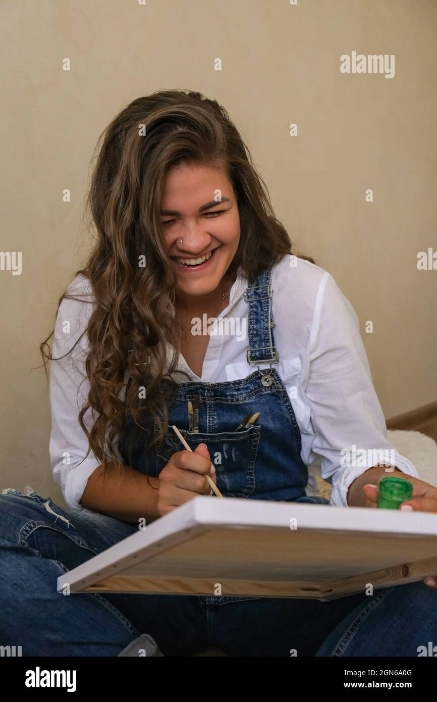 Creative painter in working process. Artist workplace, hobby, craft ...