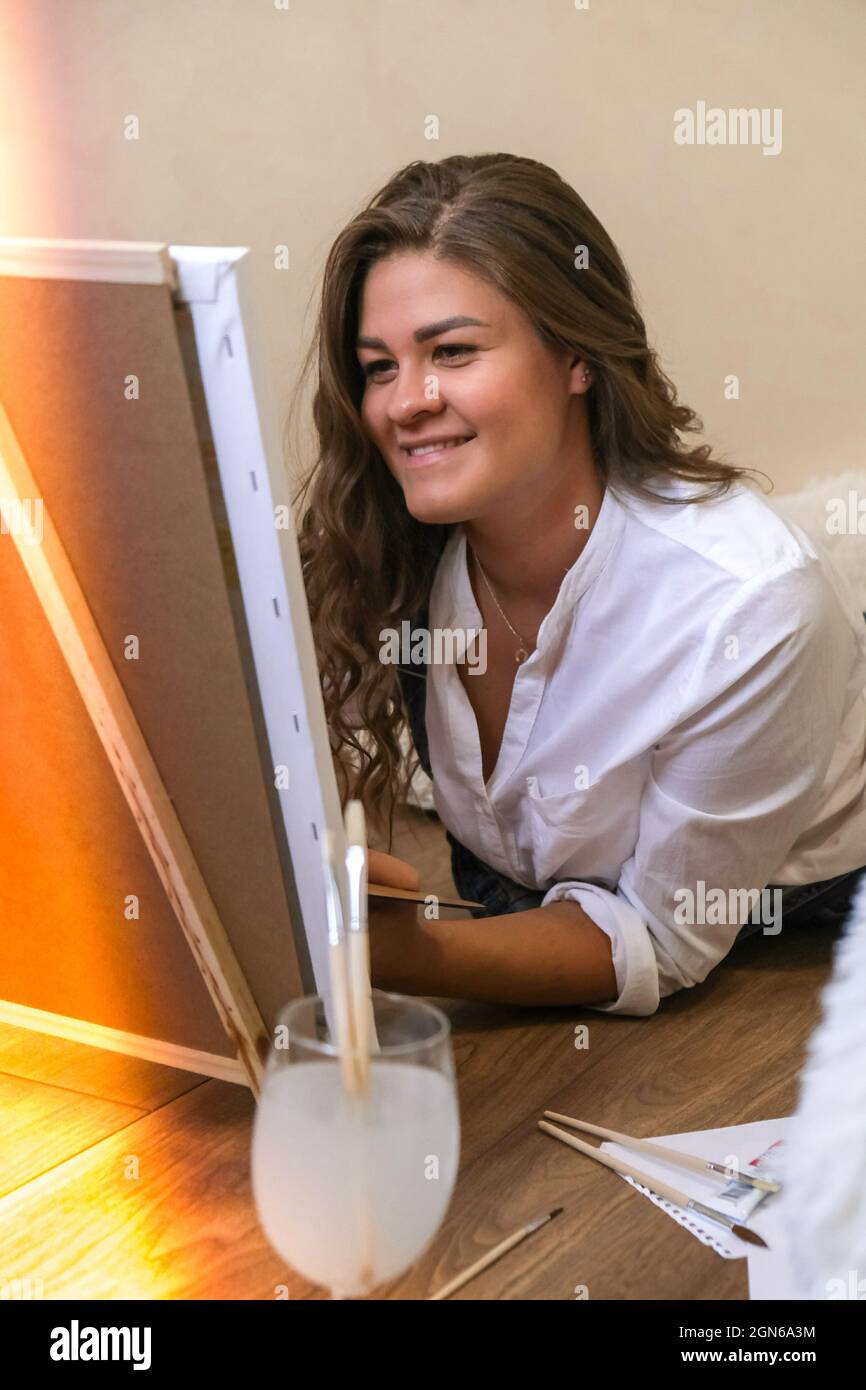 Creative painter in working process. Artist workplace, hobby, craft ...