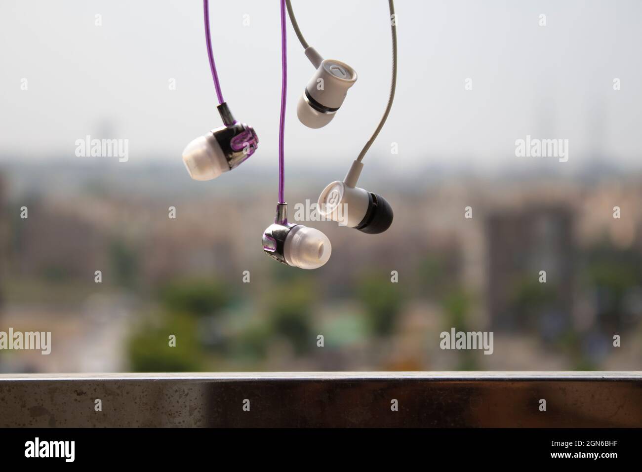 earphones hanging down Stock Photo - Alamy