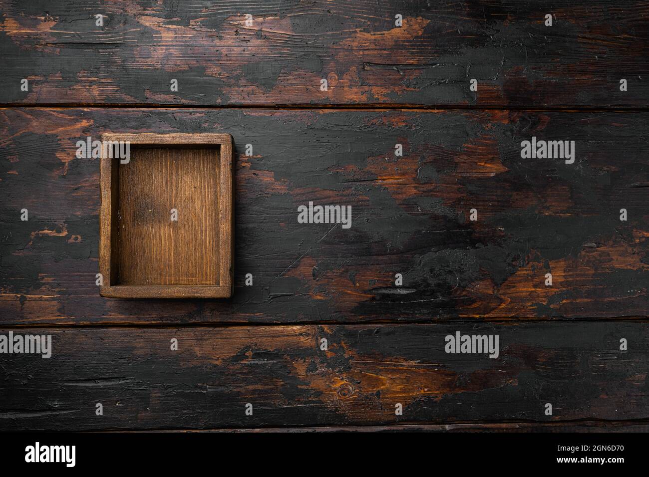 Empty dark wooden box set with copy space for text or food, top view ...