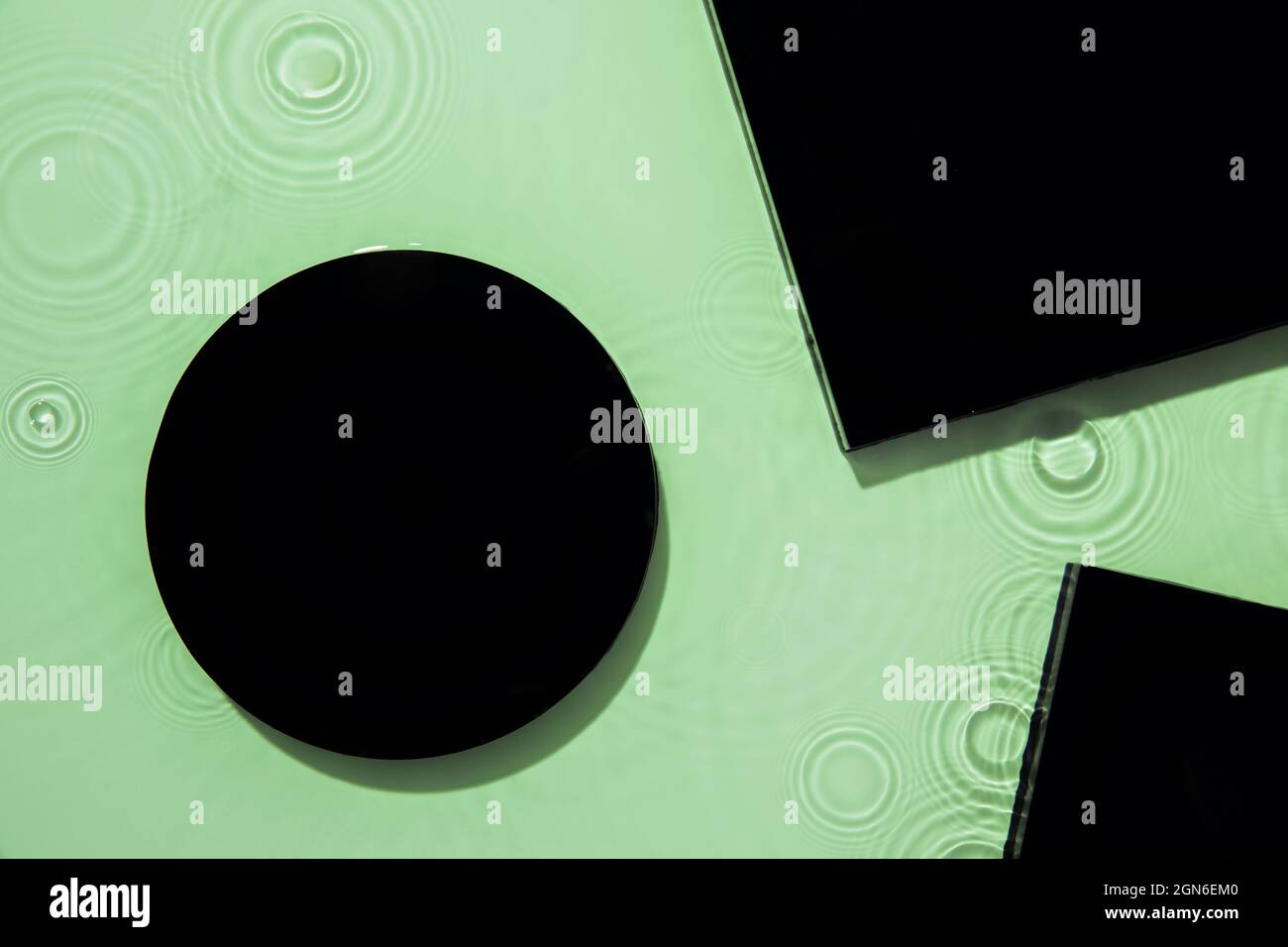 Abstract black geometric figures composition on transparent green clear ...
