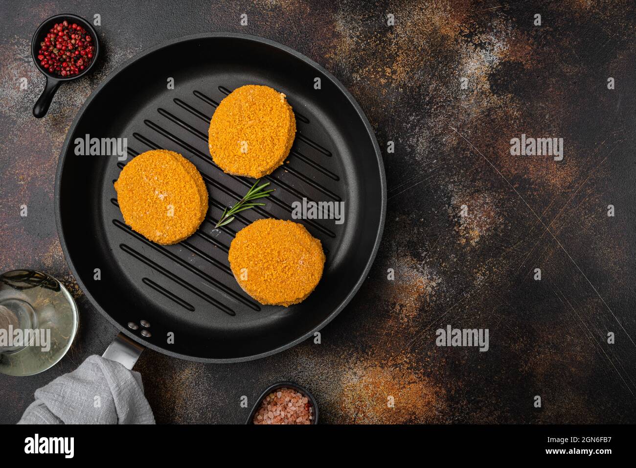 Frozen Breaded fish patties set, on old dark rustic table background ...