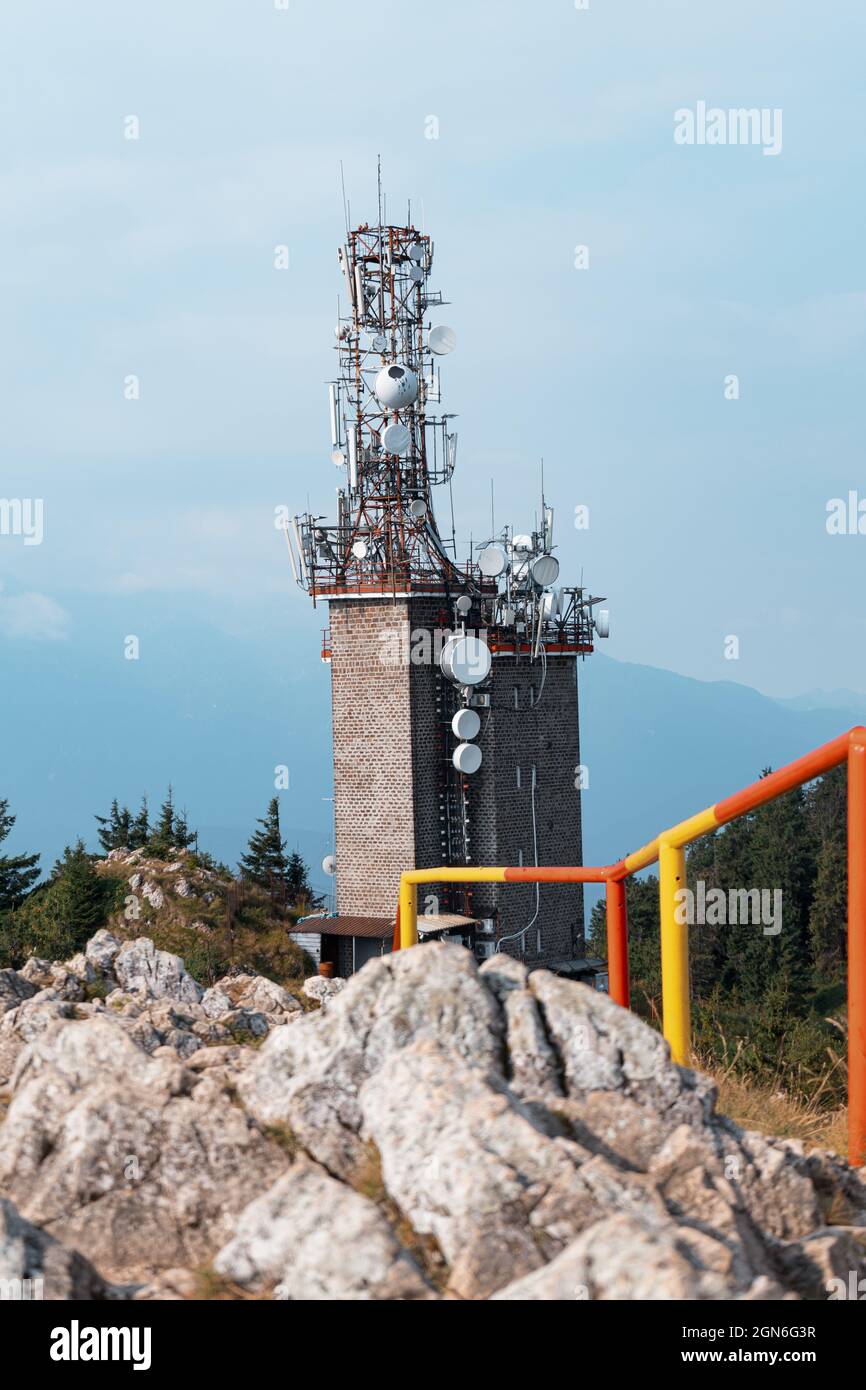 Vertical of a telecommunication tower against the cloudy blue sky Stock ...