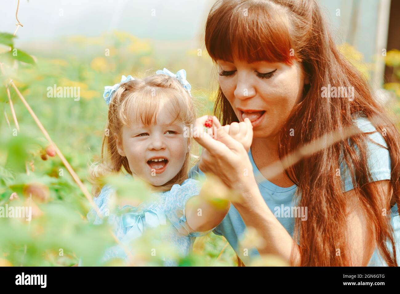 mom hugs her daughter in nature Stock Photo - Alamy
