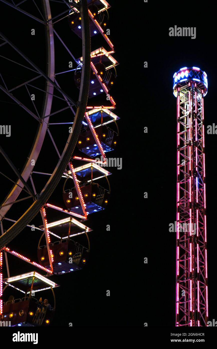 Ferris Wheel Lights at Night. Neon colored lights flashing on the ...