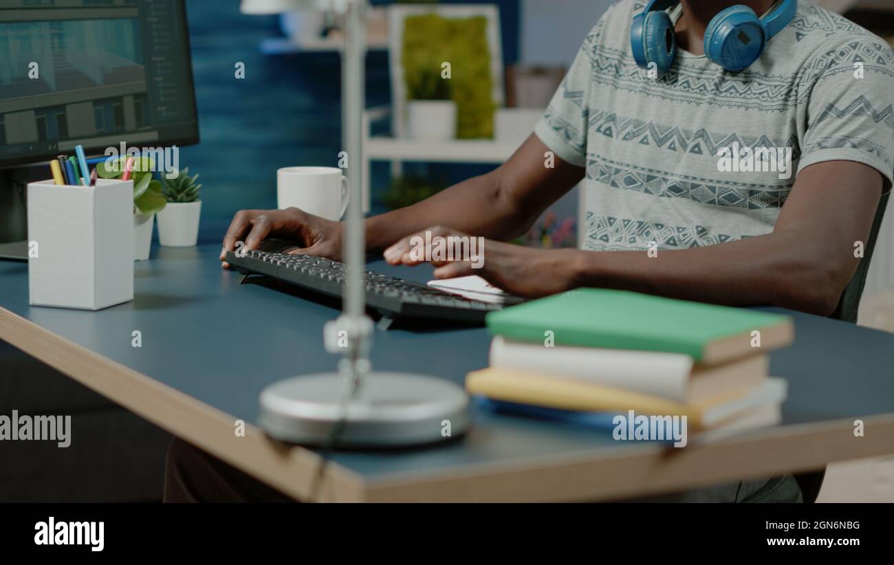 Close up of architect using keyboard and computer for building design ...