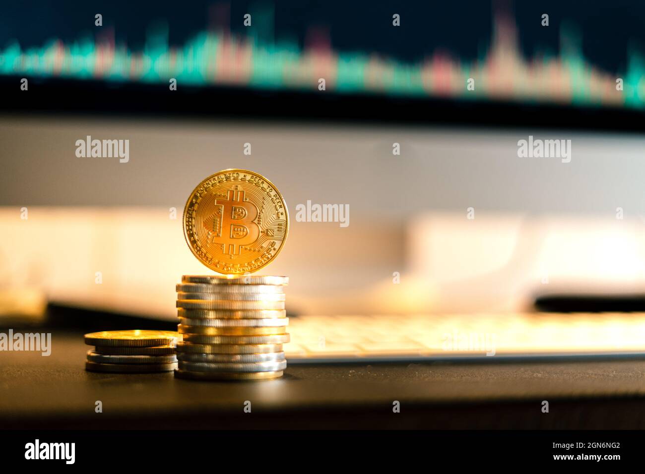 Bitcoin is placed on a desk in front of a computer Stock Photo - Alamy