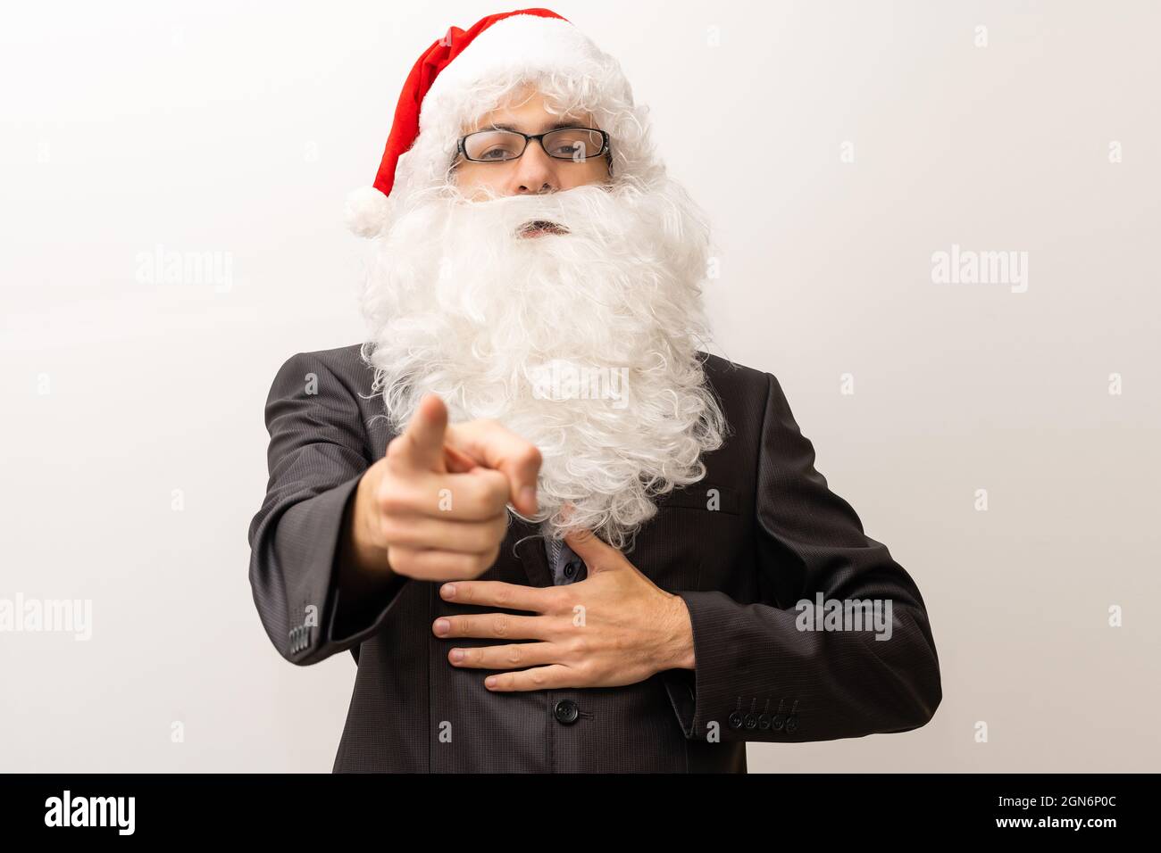 santa laughs and shows a finger on a white background Stock Photo - Alamy
