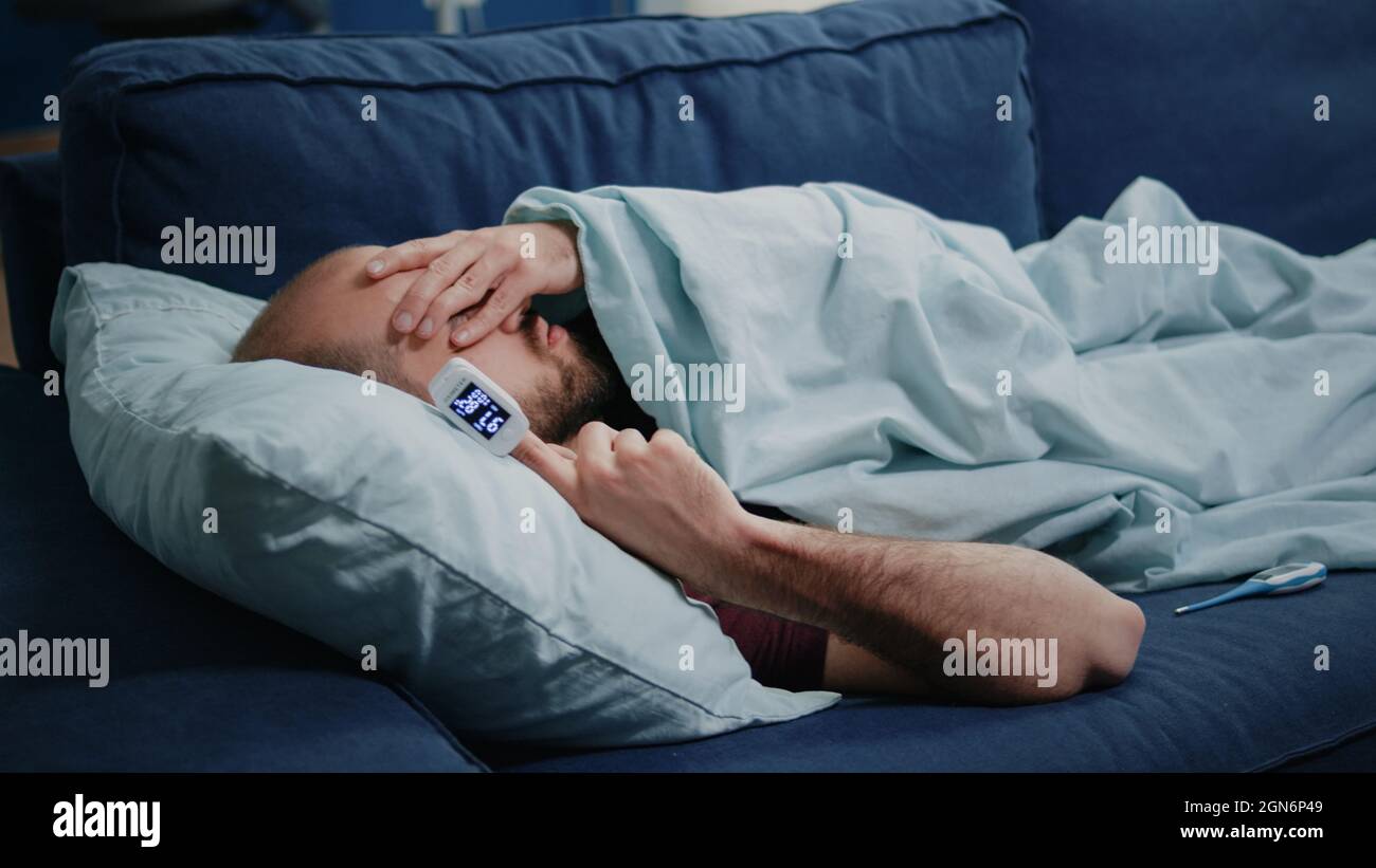 Close up of adult using oximeter for disease diagnosis. Medical device ...