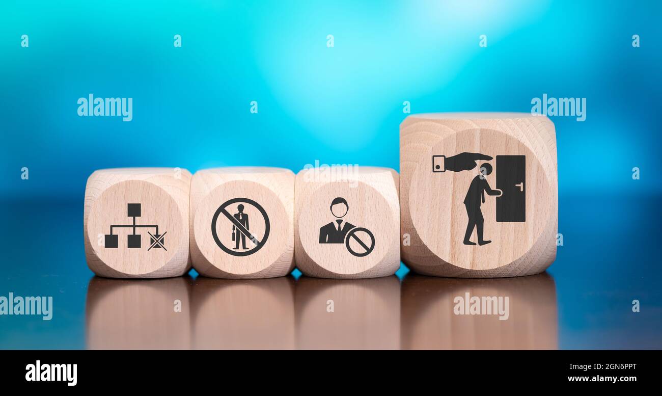 Wooden blocks with symbol of job loss concept on blue background Stock ...