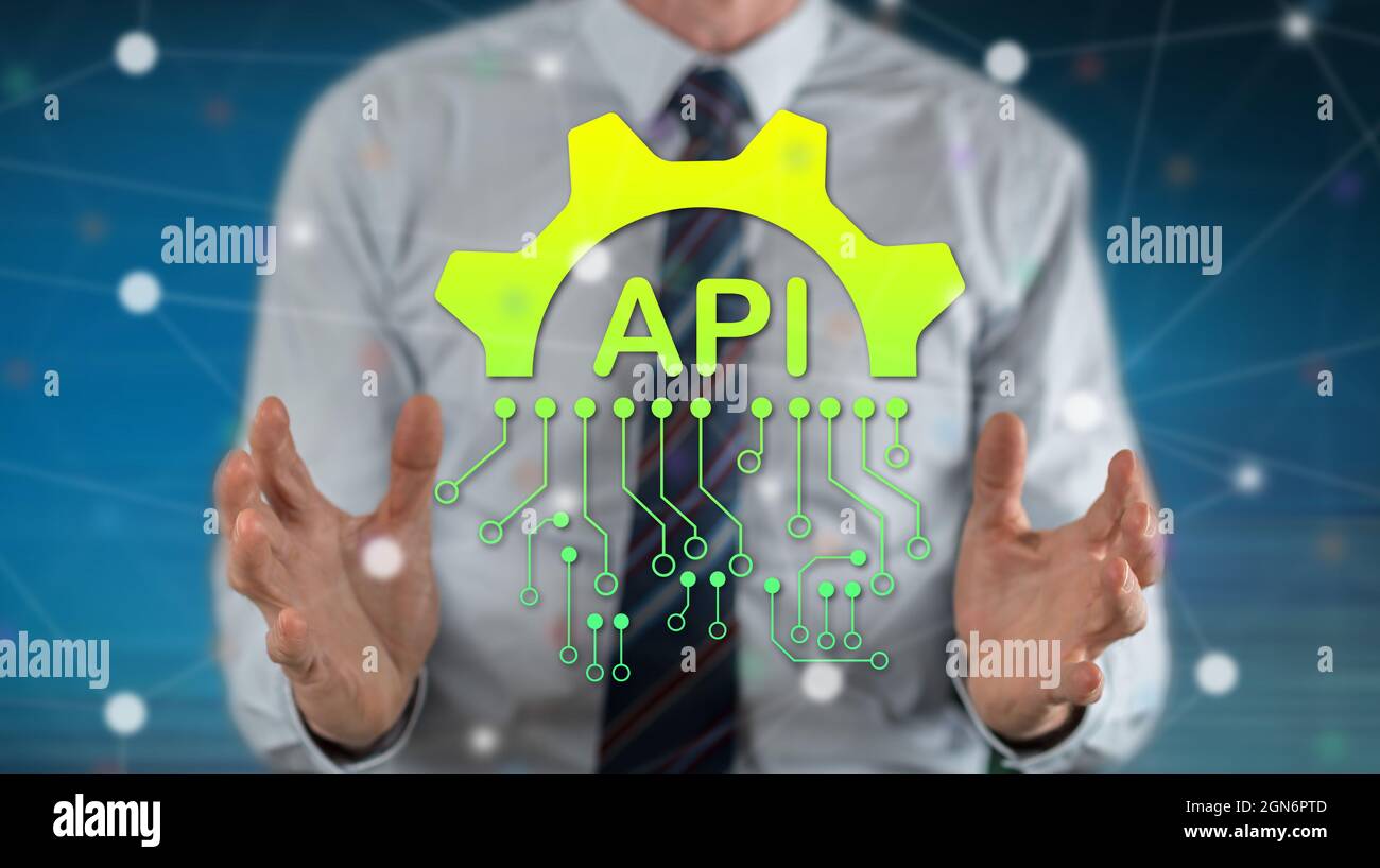 Api concept between hands of a man in background Stock Photo - Alamy