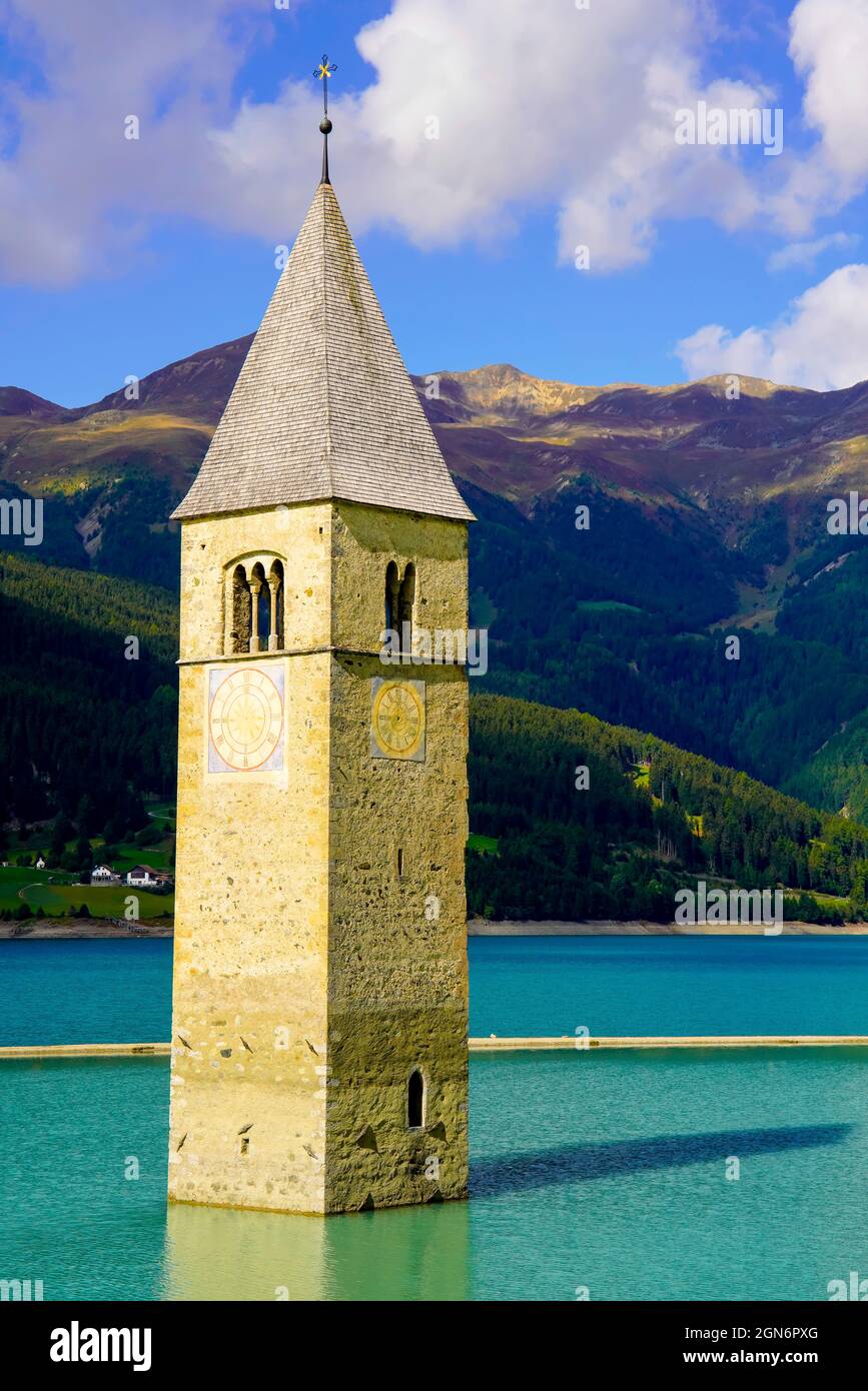 Only the lone bell tower church shoots up from the water of the lake in ...