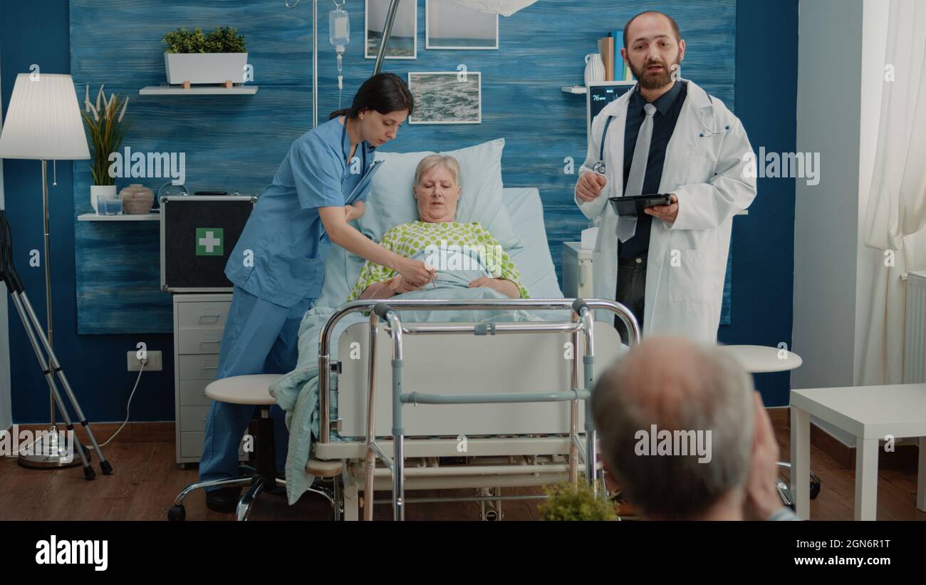 Nurse doing healthcare checkup aged hi-res stock photography and images ...