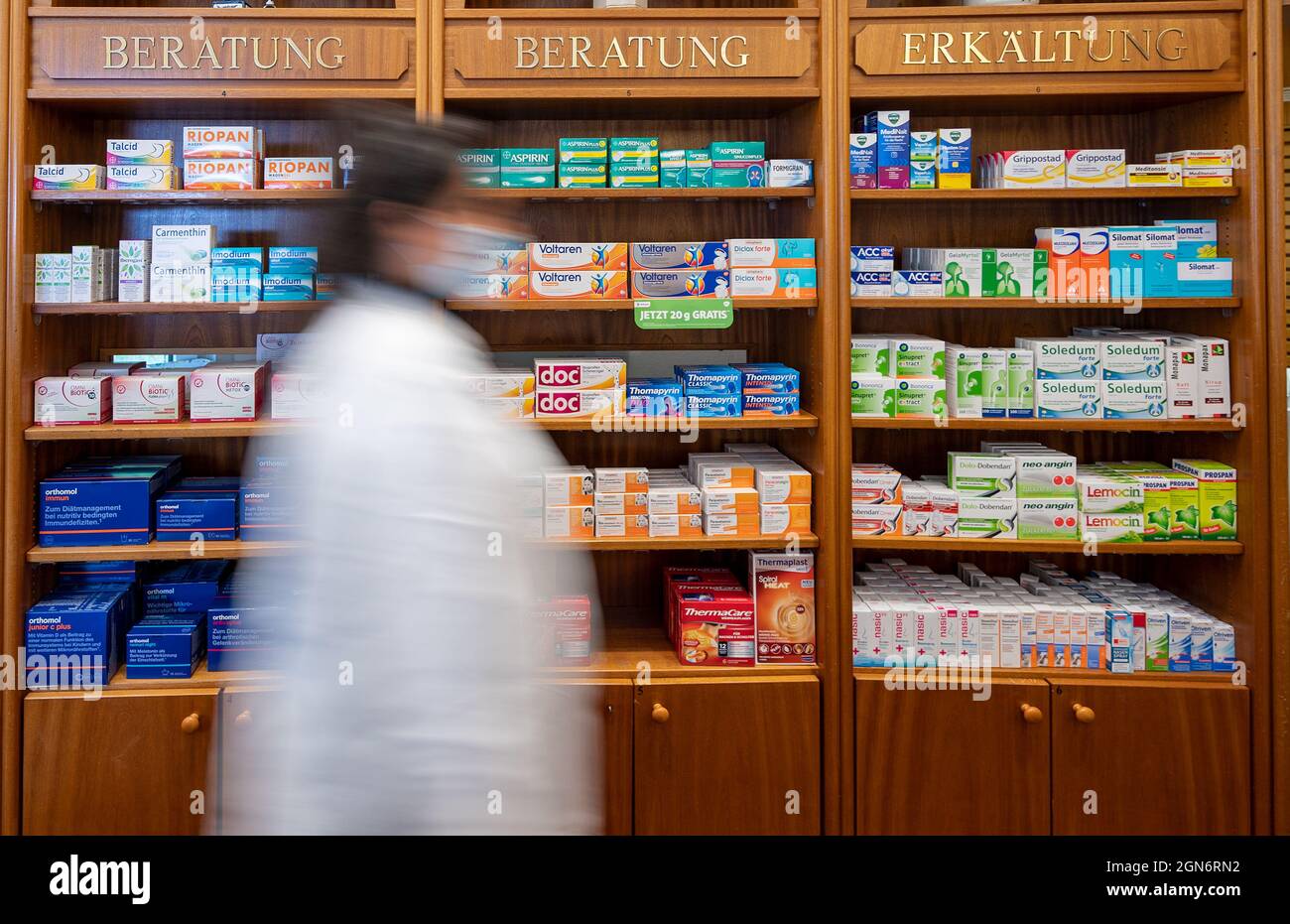 Berlin, Germany. 21st Sep, 2021. An employee walks past a shelf of ...