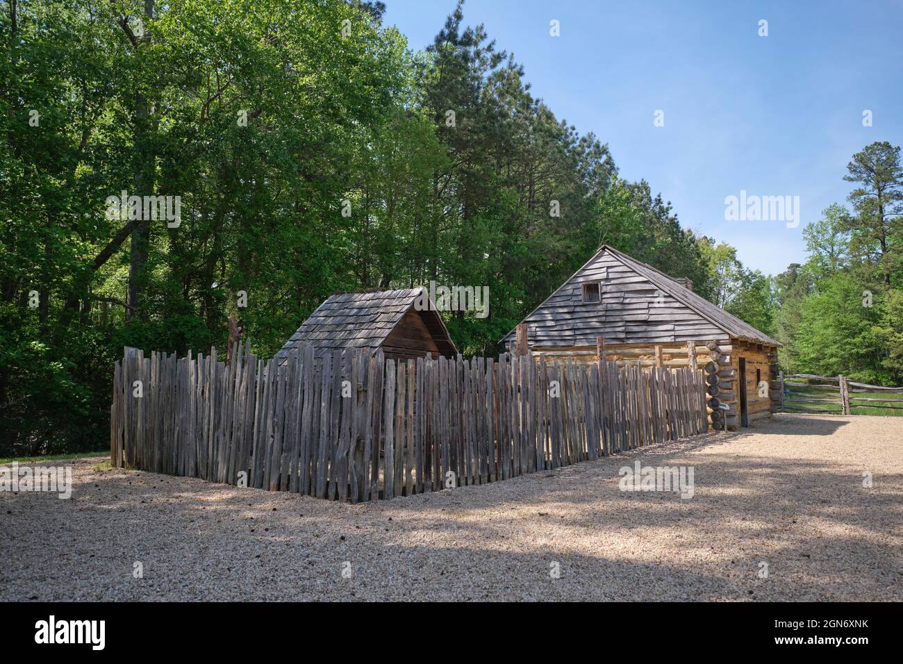 Slave quarters log cabin house and yard at the Tudor plantation. At the ...