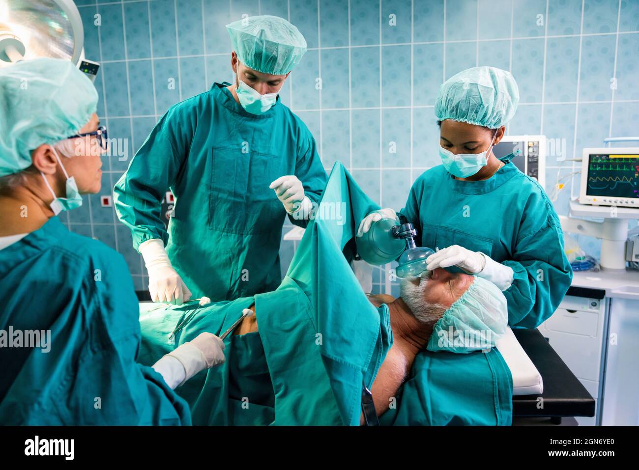 Surgery team operating in a surgical room Stock Photo - Alamy