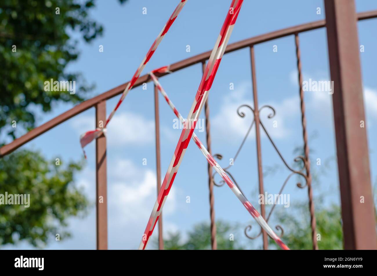 Close-up of the barrier tape tied to the bridge. Red and white t Stock ...