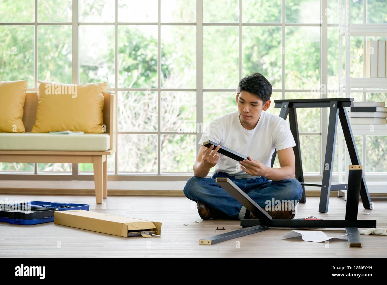 Handyman installing wooden bench in new house. House renovation service ...