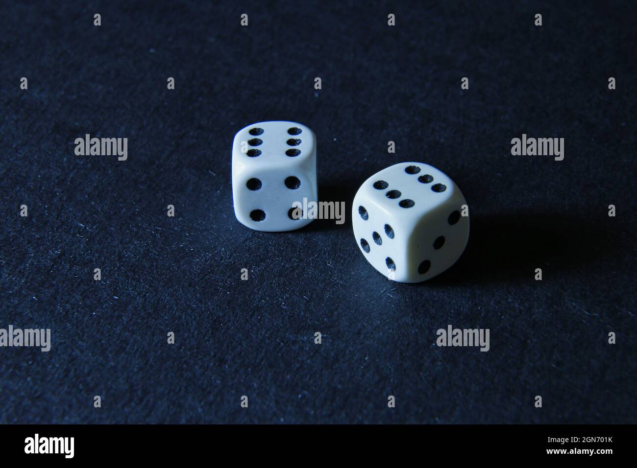 Who will win the roll dice Stock Photo - Alamy