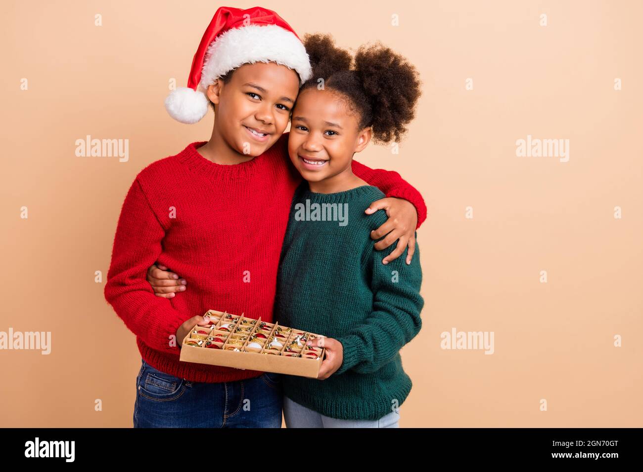 Photo of dreamy cute kids hug hold tree toys shiny smile wear x-mas hat ...