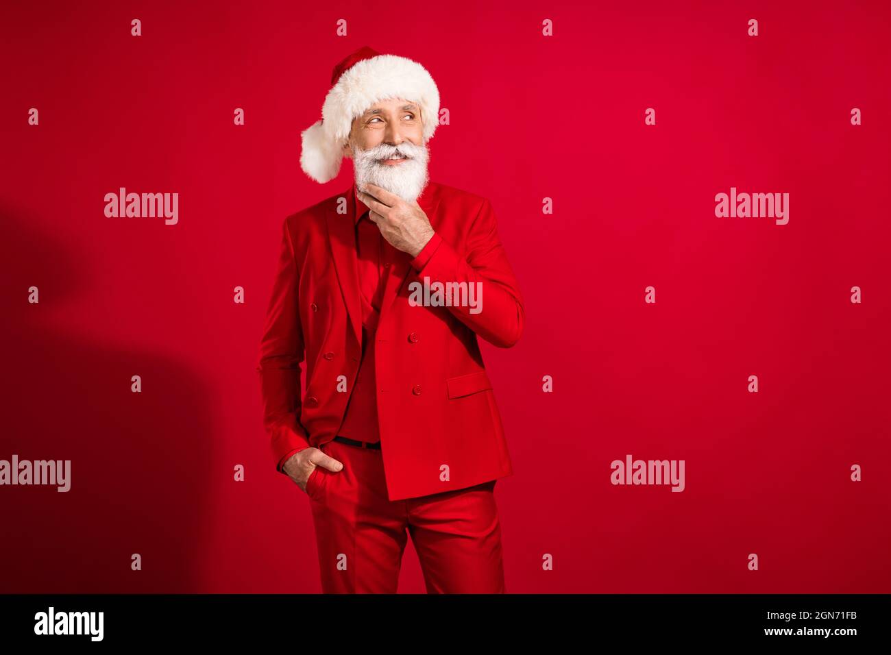 Photo of minded smart santa claus hand chin look empty space think ...