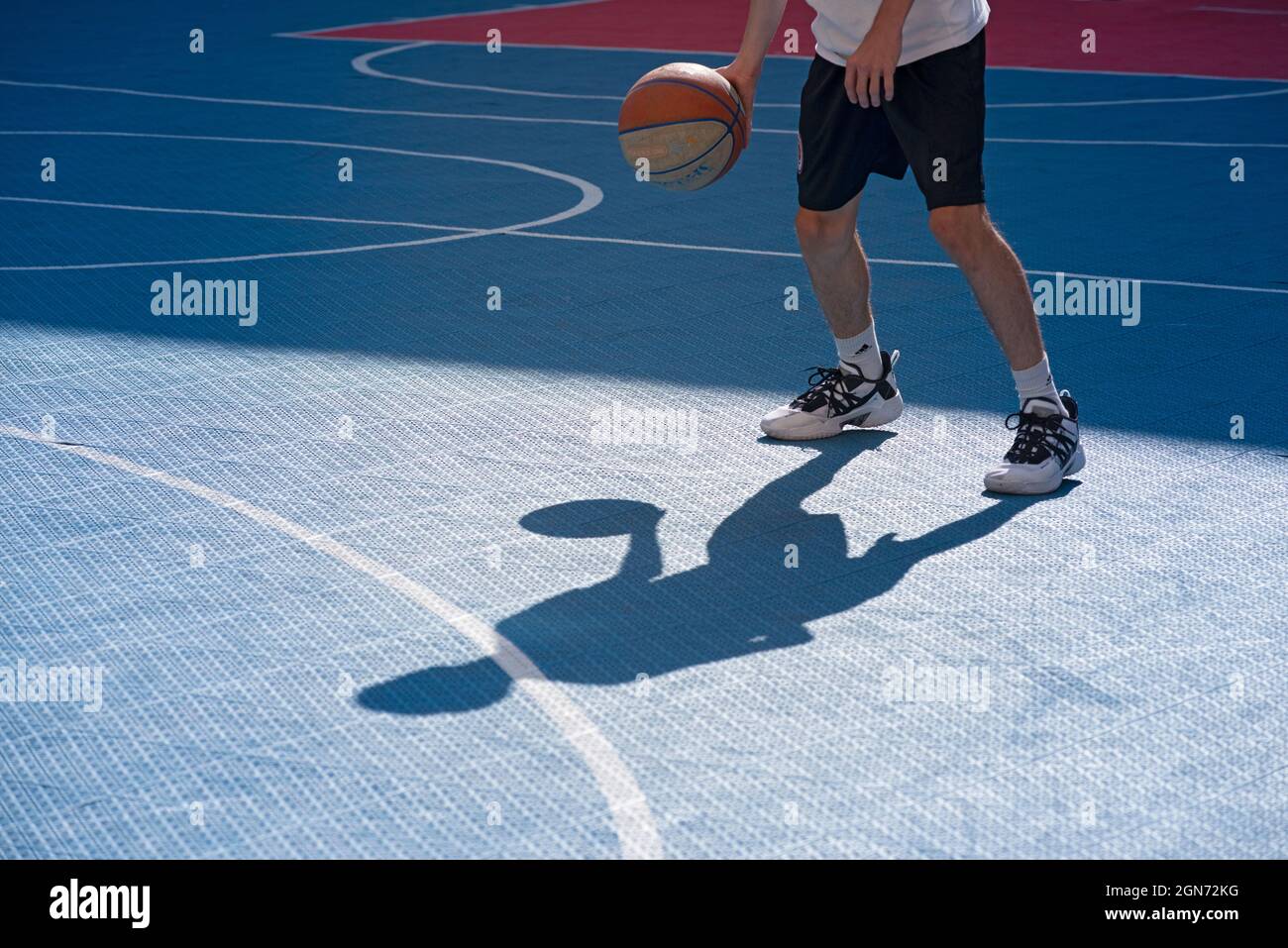 Low section basketball player playing hi-res stock photography and ...
