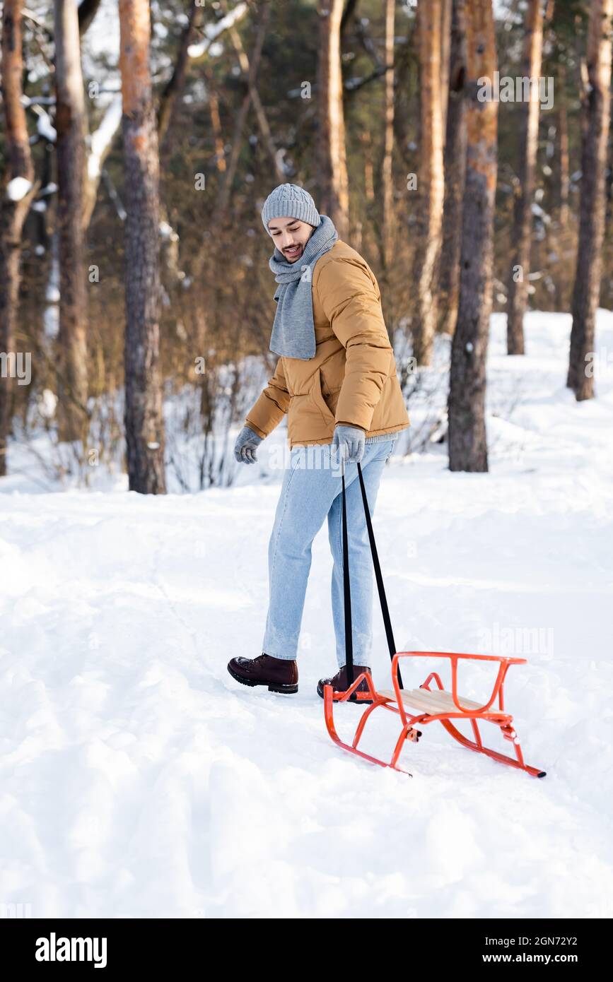 Couple pulling sled in snow hi-res stock photography and images - Alamy