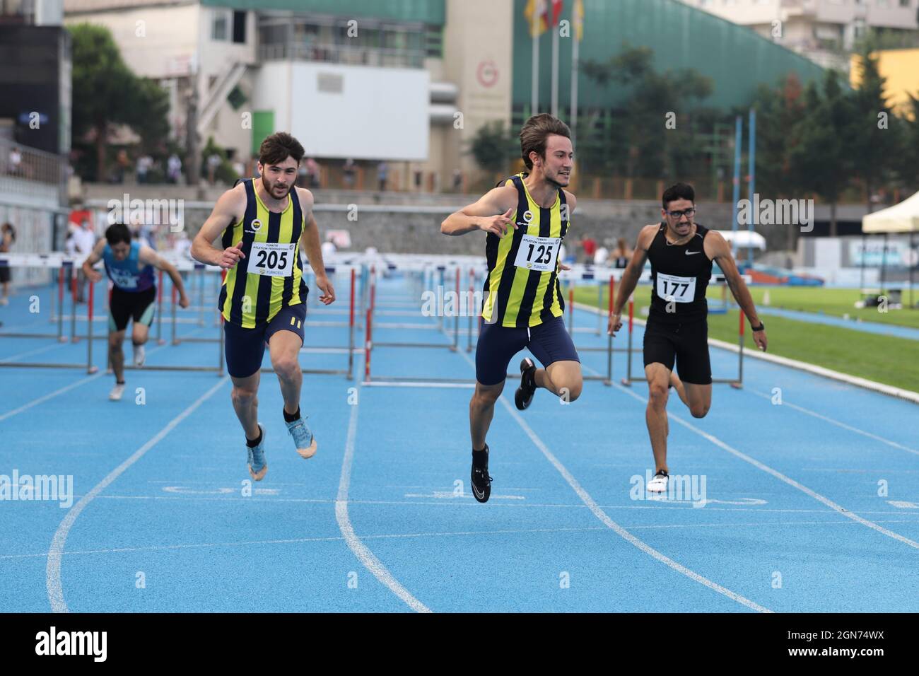 ISTANBUL, TURKEY - JUNE 23, 2021: Athletes running 100 metres hurdles ...