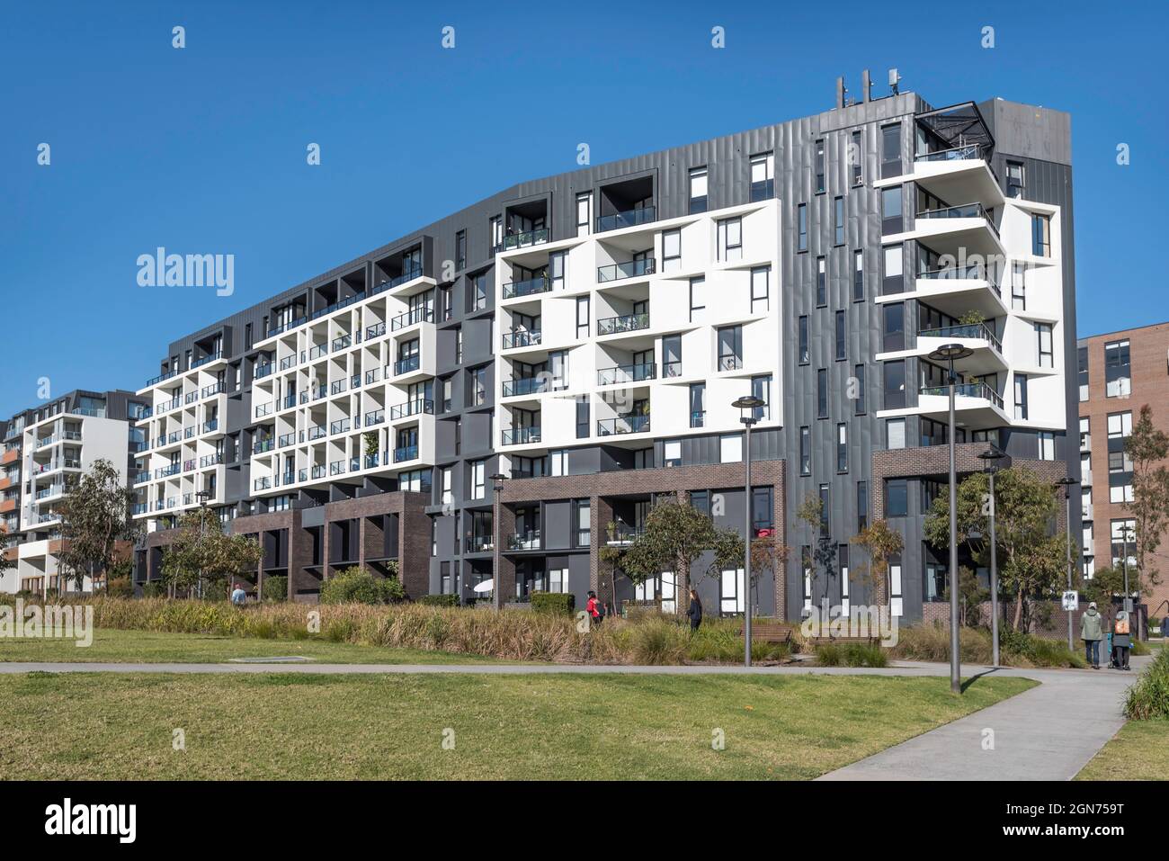 High rise apartment blocks in front of a large green open space in the ...