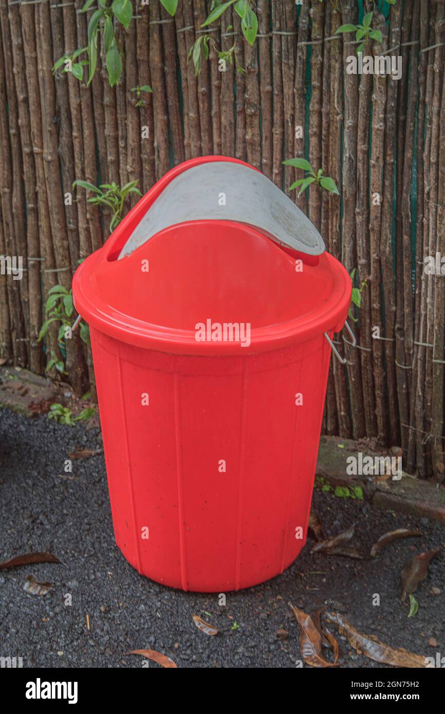 Colorful Dustbin in the garden Stock Photo - Alamy