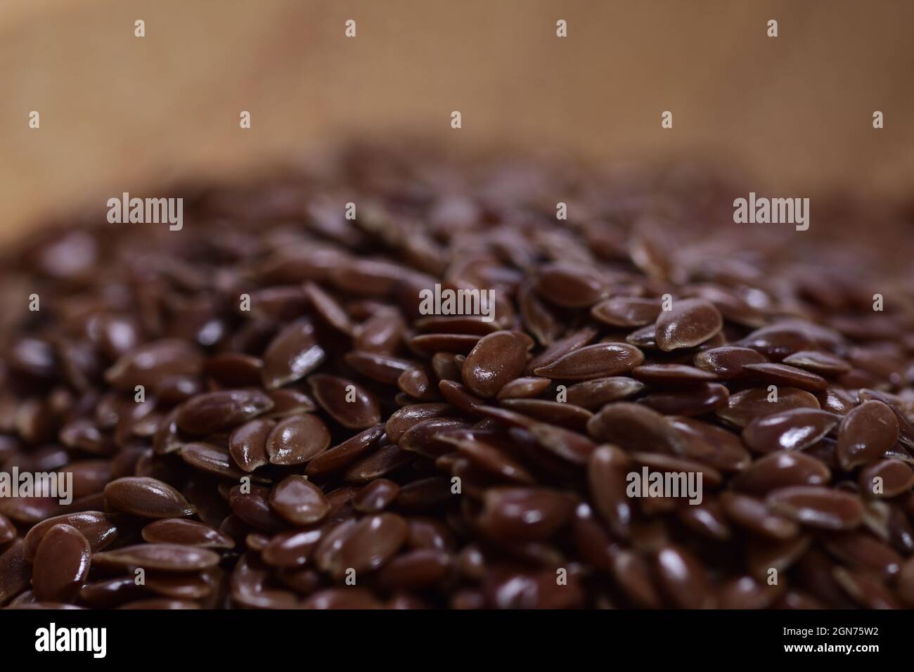 Linseed on a wooden bowl against a white background. Food Stock Photo ...