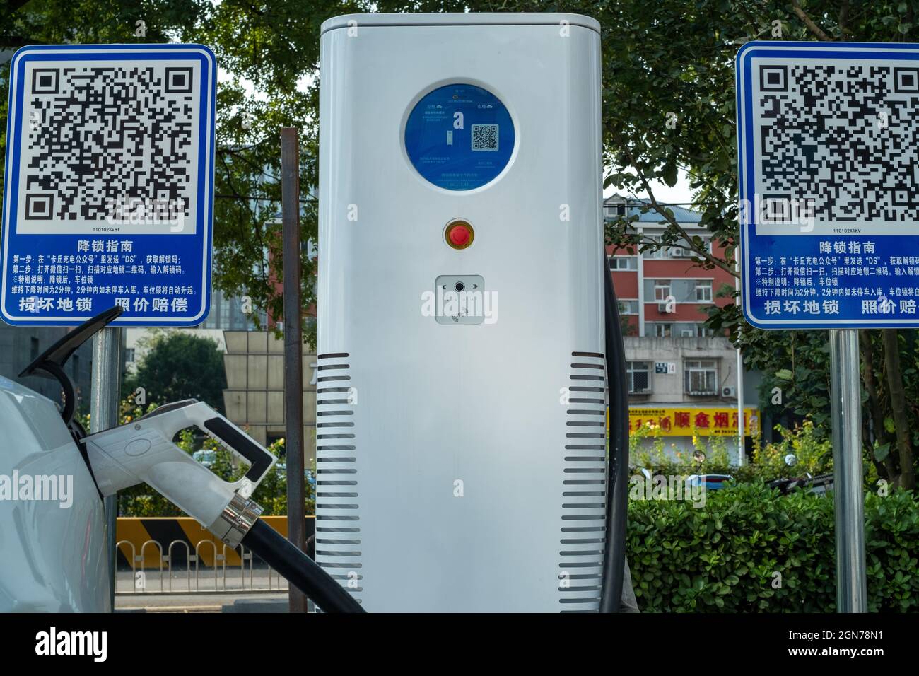 A Tesla Model3 is charging at a new charging station in Beijing, China ...