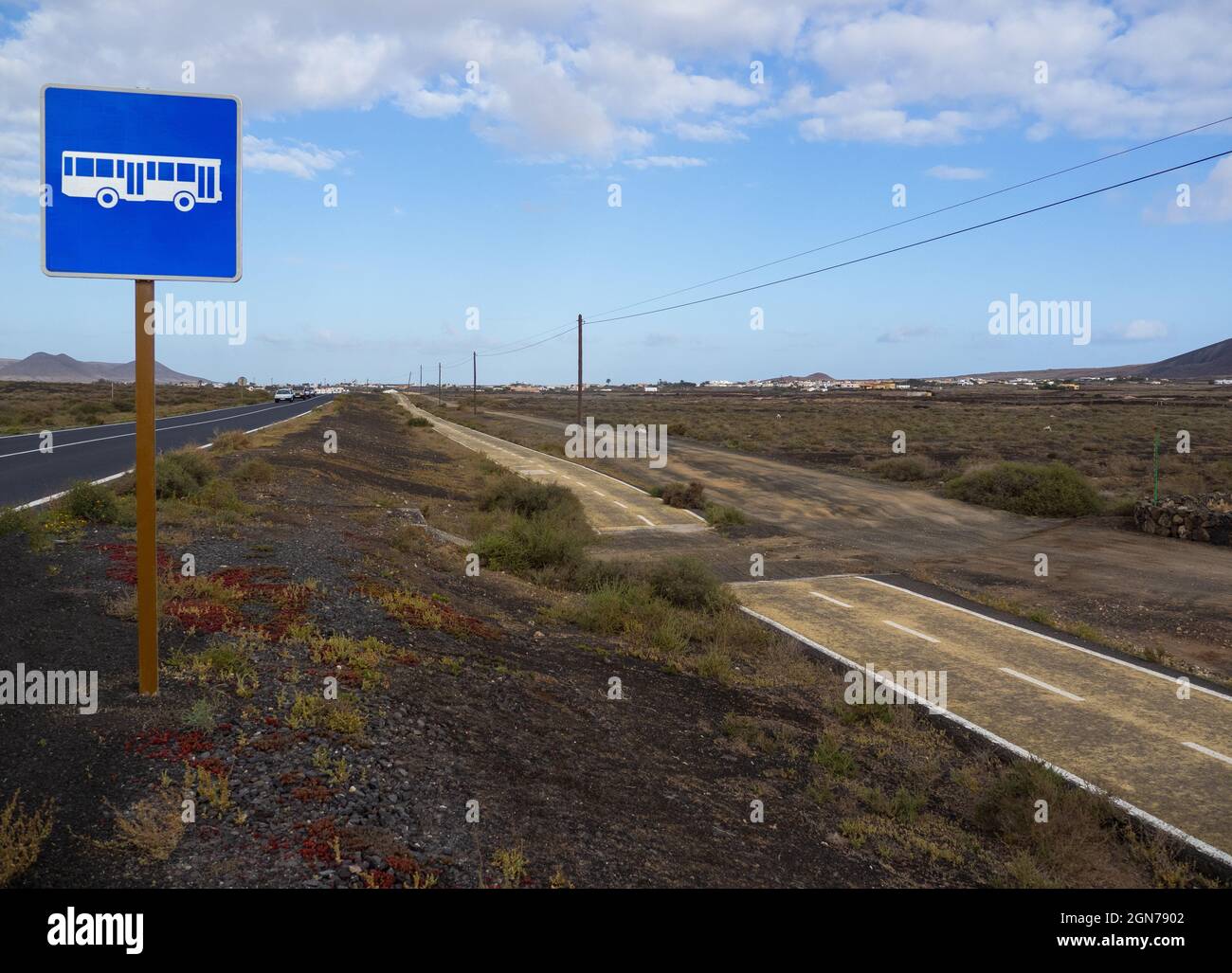long empty bike path crosses an uninhabited area, Fuerteventura, Canary ...