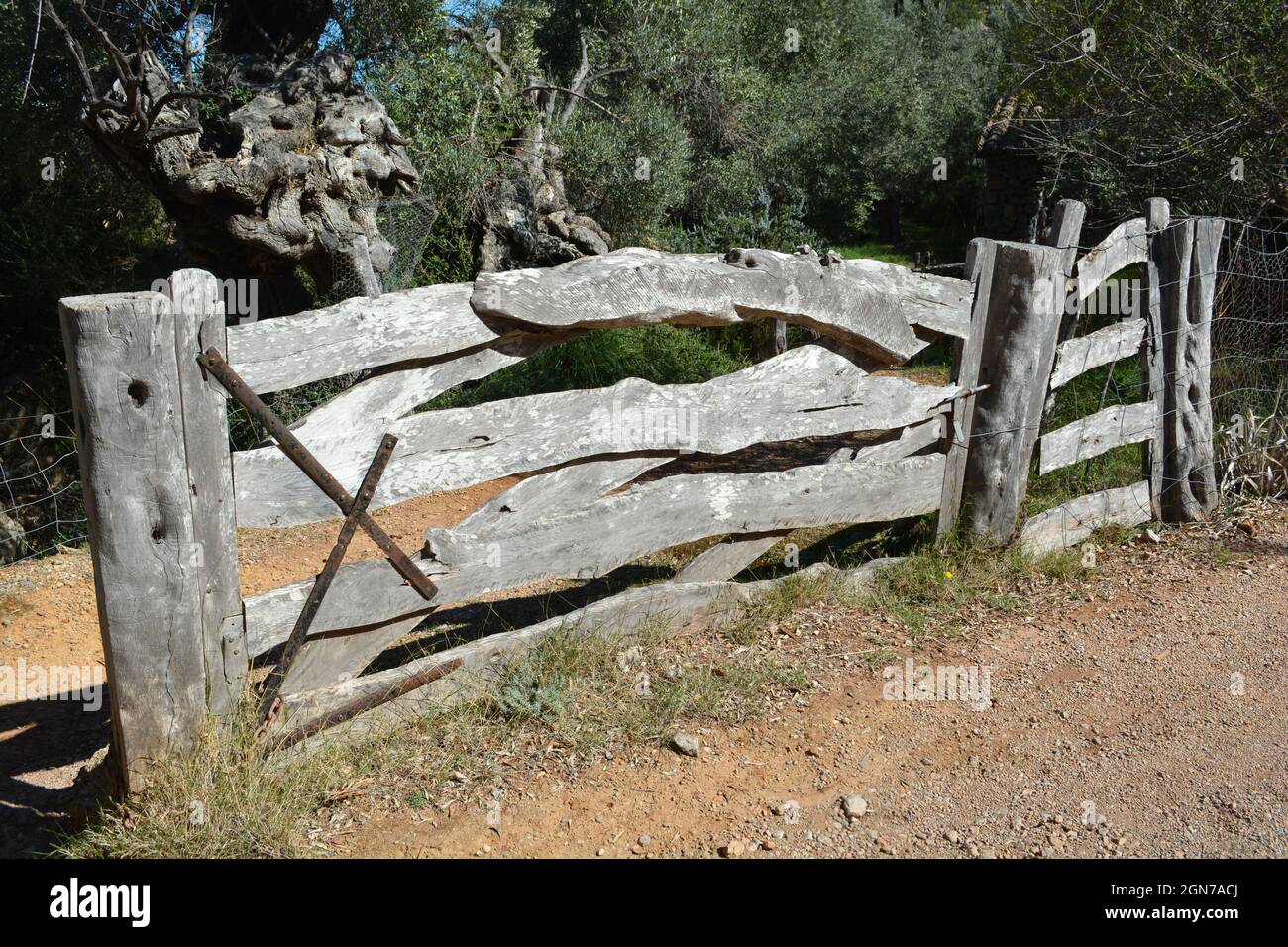 Rustic gate on the hiking trail from Port de Sóller along the coast ...