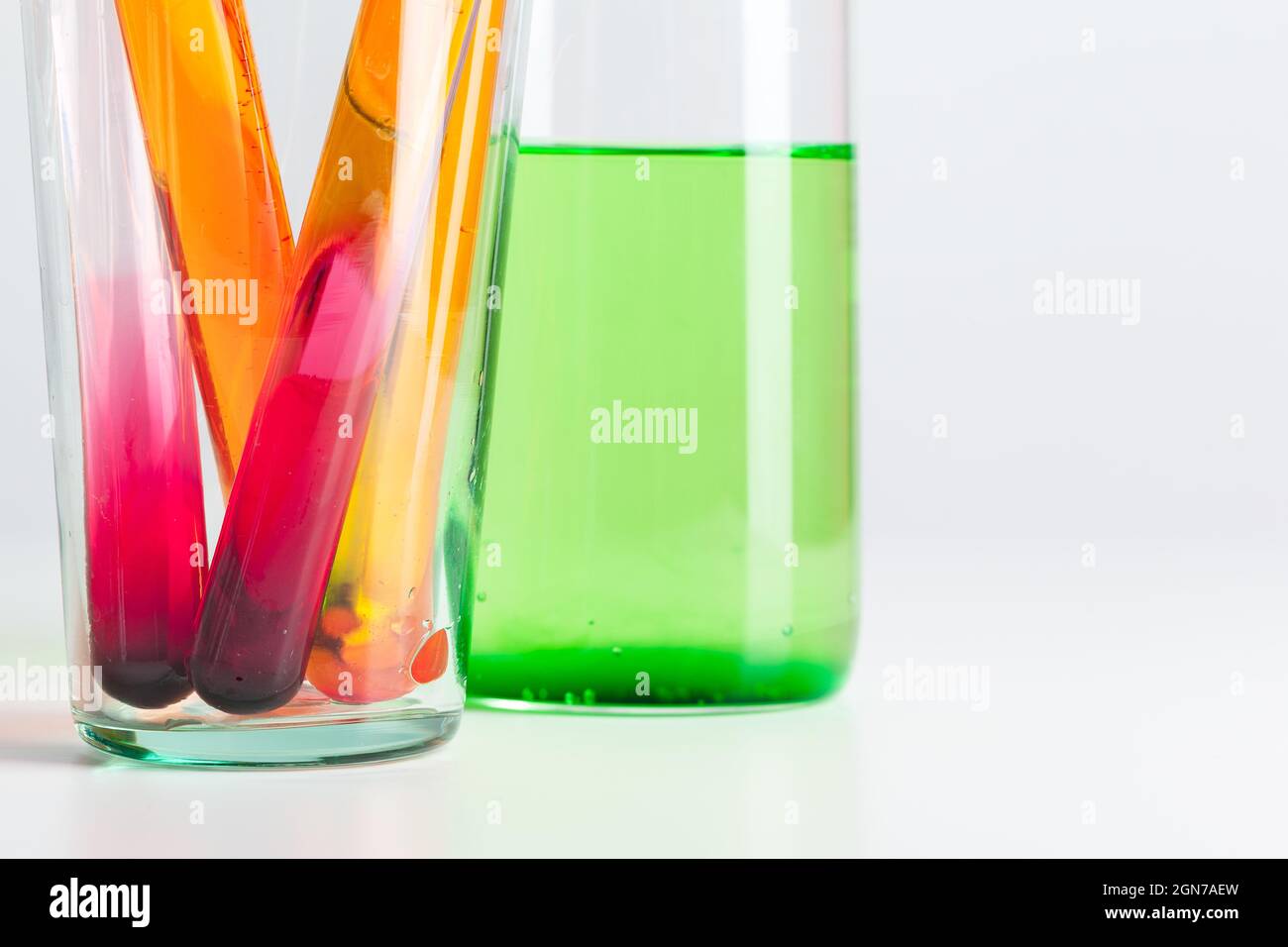 Test flasks with color samples on light grey background Stock Photo - Alamy
