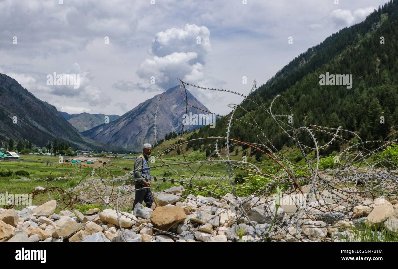 September 23, 2021, Srinagar, Kashmir, India: A man walks through a ...