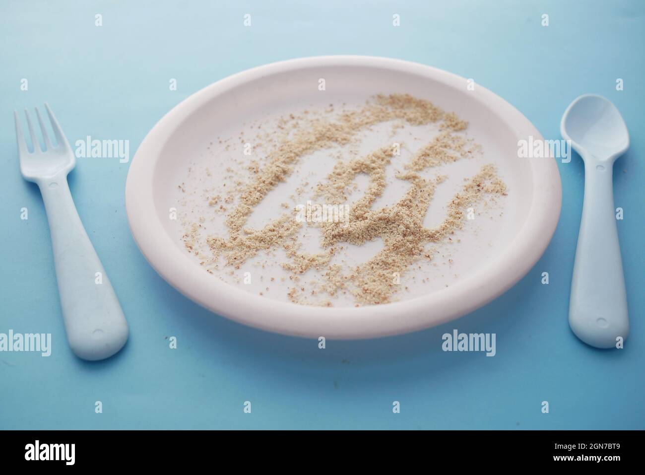 Empty plate after eating on table Stock Photo - Alamy