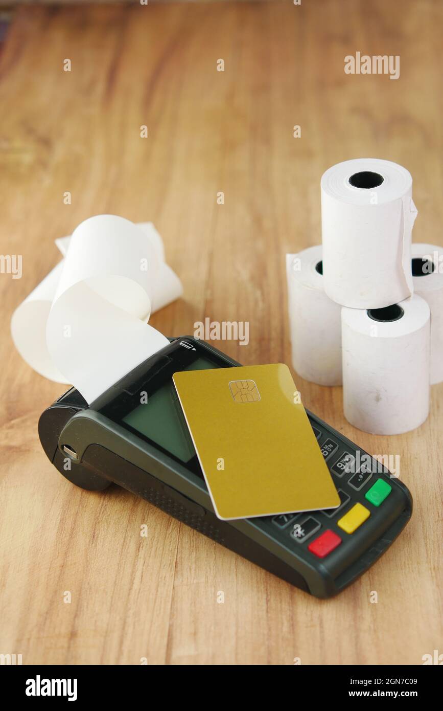 contactless payment concept with credit card and pos machine on table ...