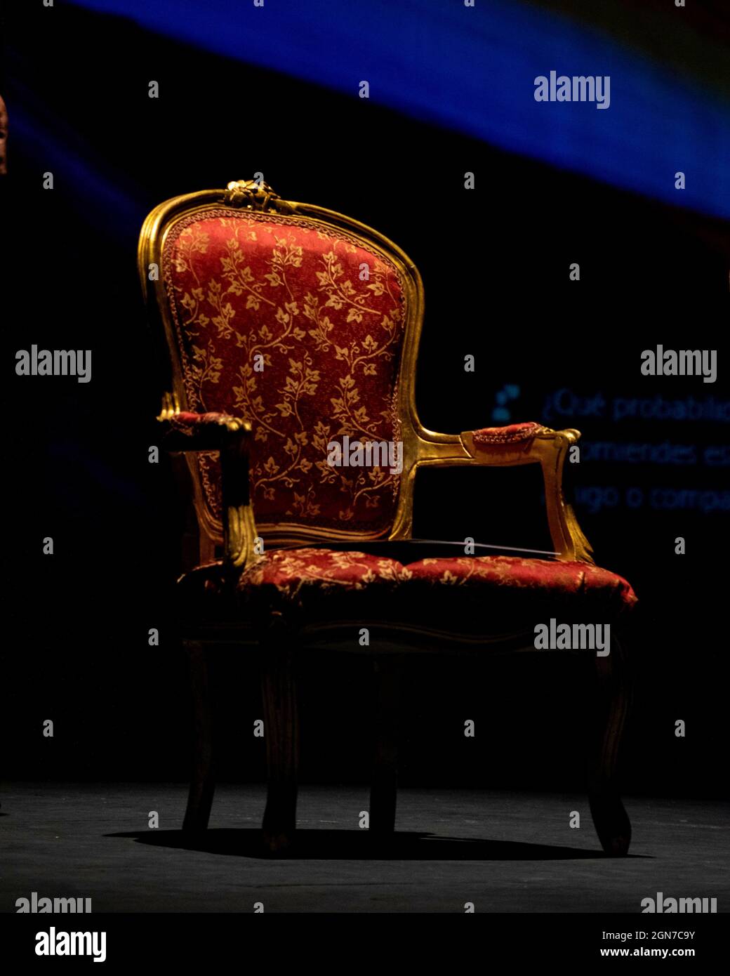 Vertical shot of an antique chair on the stage in a dark light Stock ...